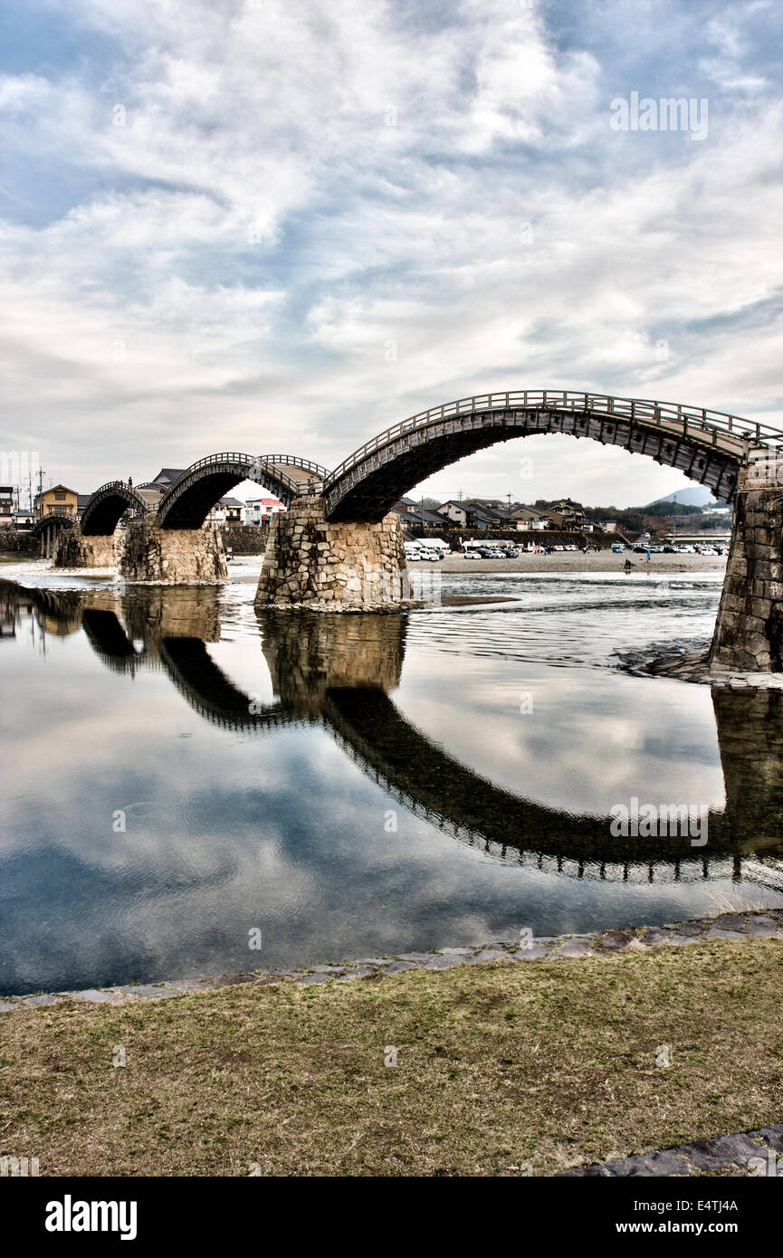 The historical wooden arch Kintai bridge spanning the Nishiki River at ...