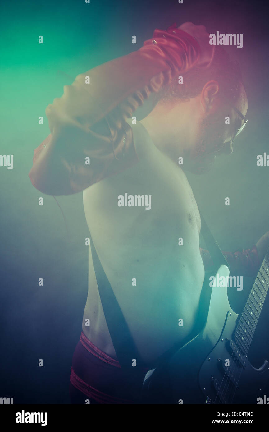 rocker man with electric guitar in a rock concert Stock Photo - Alamy