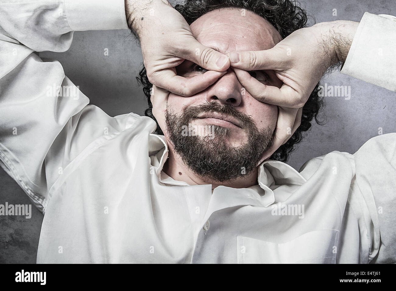 Chief, hands as a mask, man in white shirt with funny expressions Stock ...