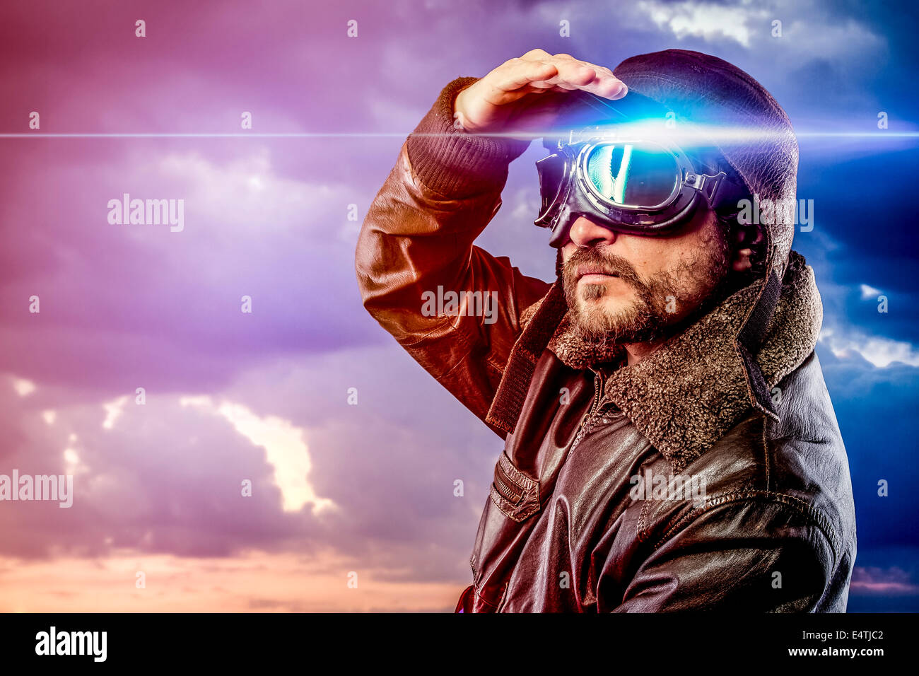 man dressed as pilot in helmet on clouds background. Vintage pilot ...