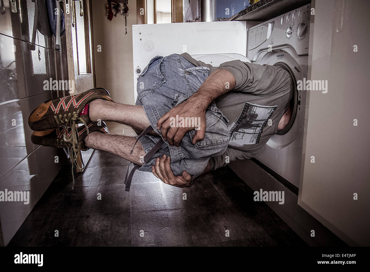 man flying with his head stuck in a washing machine Stock Photo - Alamy