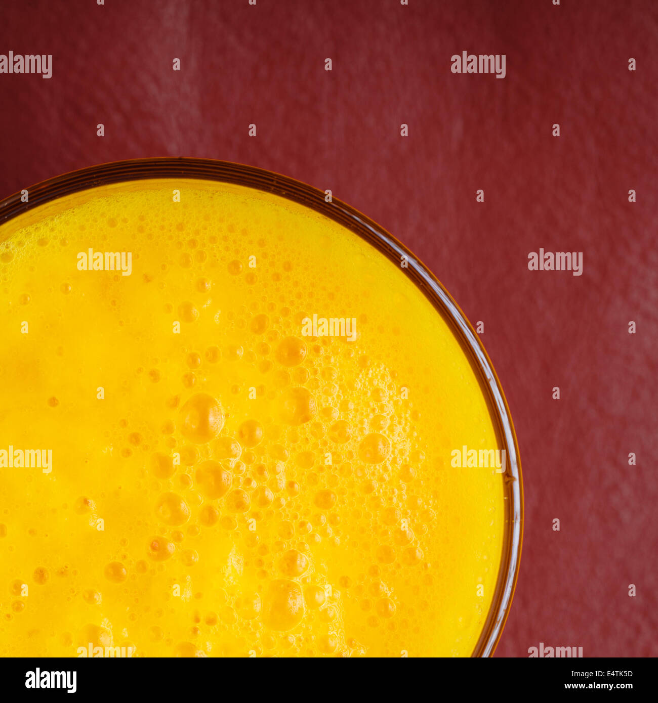 Diet healthy nutrition. Closeup of fresh yellow fruit juice in glass ...