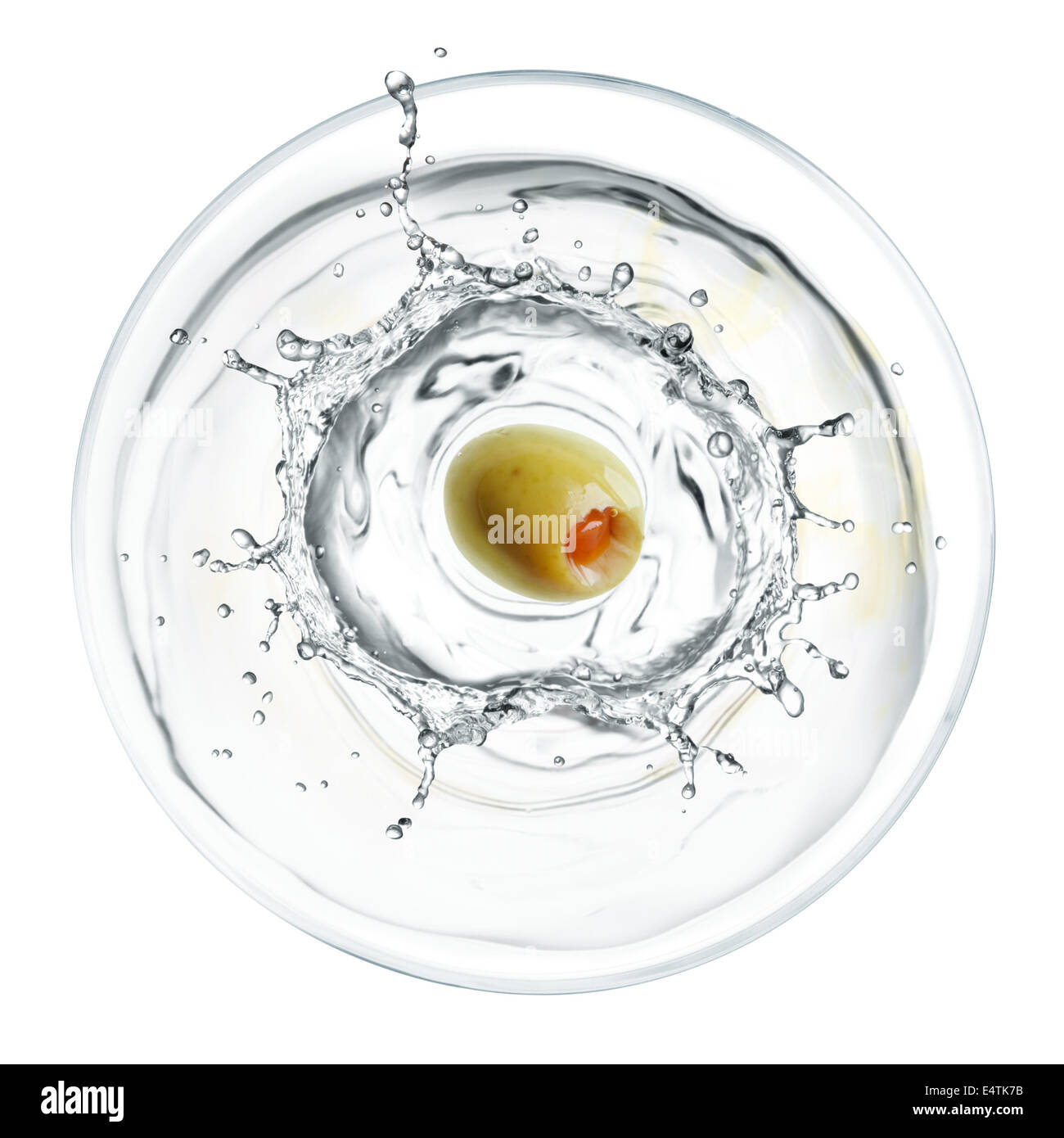 glass of splashing martini with olive from top view Stock Photo - Alamy