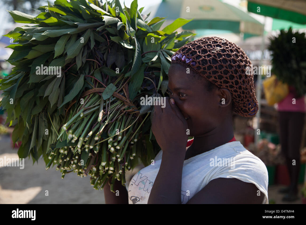Angola lady with cassava crop plants starch food informal trader Stock ...