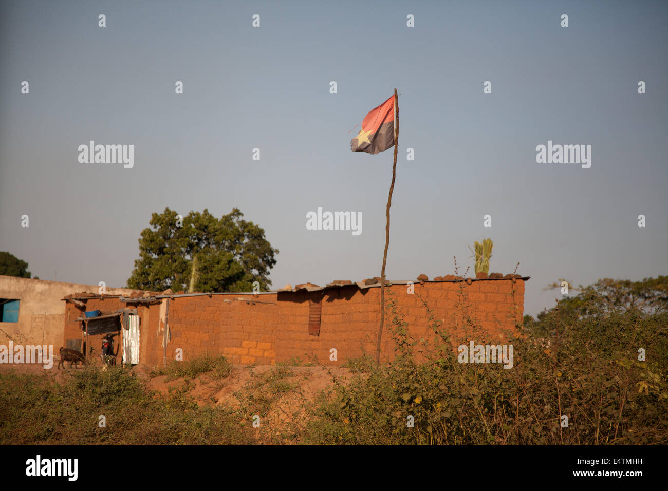 Angola, Luanda, rural homes with national flag Africa daily life Stock ...
