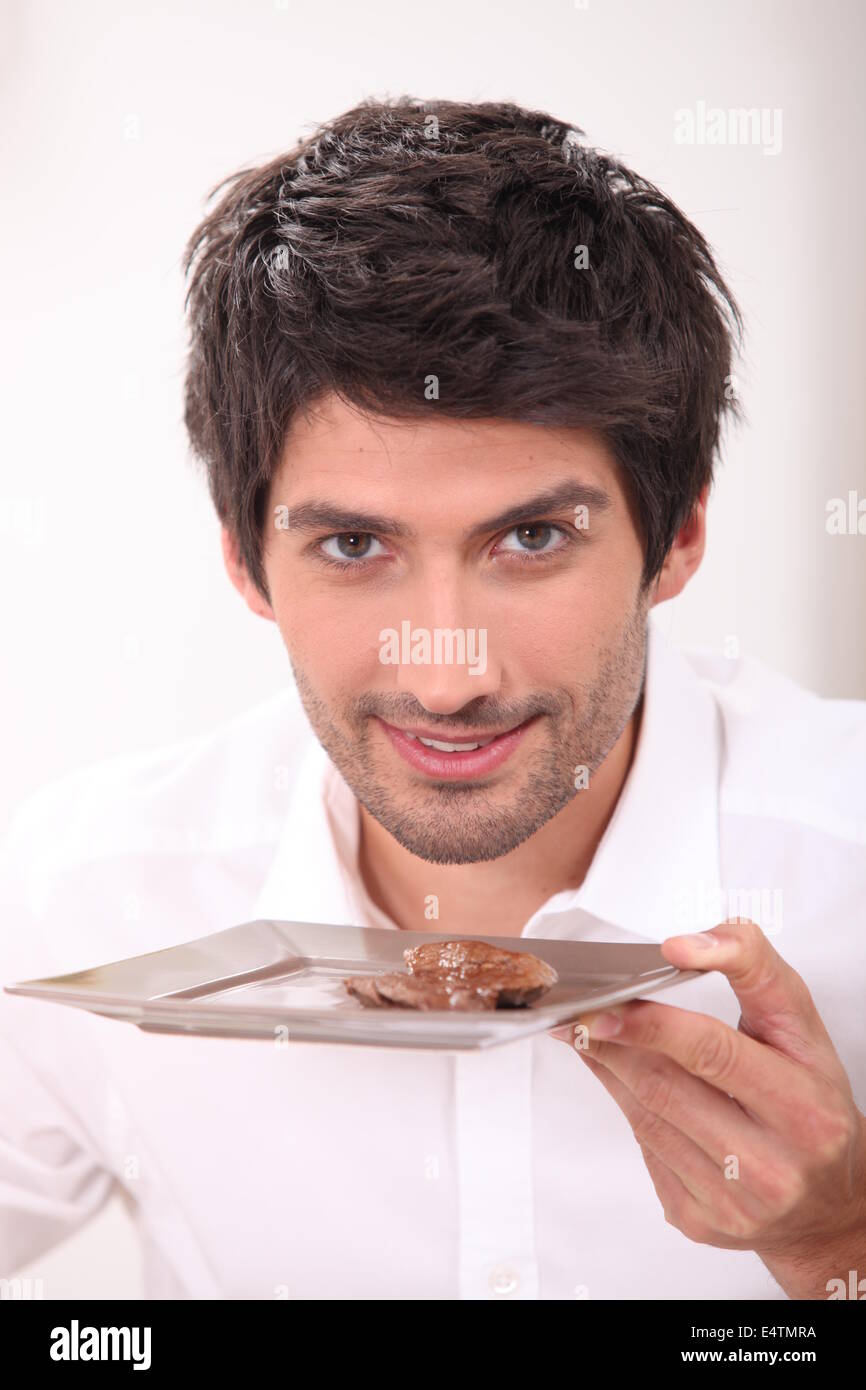 well dressed man with a nice dish Stock Photo - Alamy