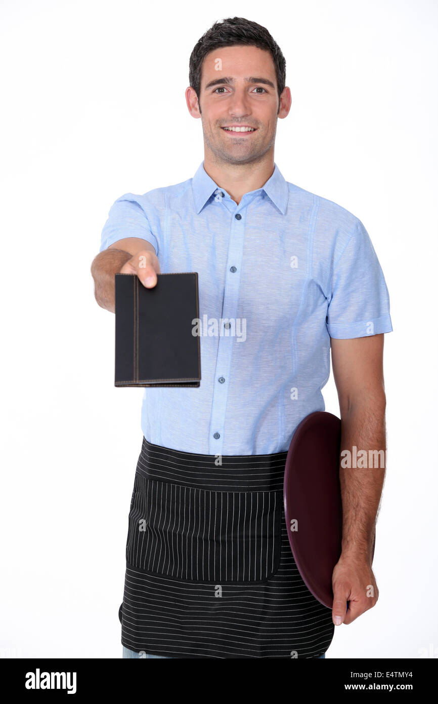 Waiter giving back a wallet Stock Photo - Alamy