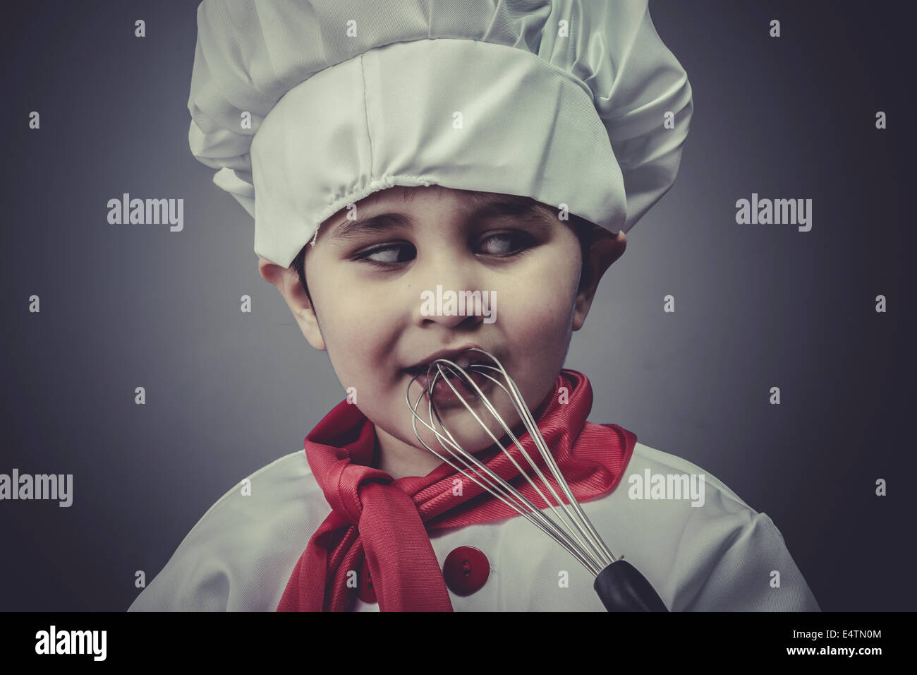 boy dressed as a cook with kitchen utensils Stock Photo - Alamy