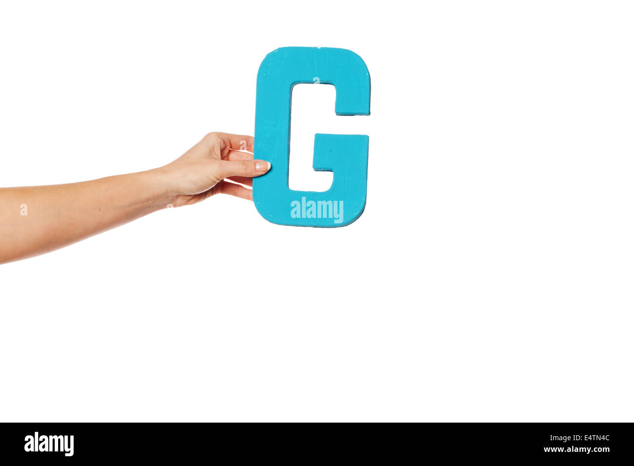 hand holding up the letter G from the left Stock Photo - Alamy