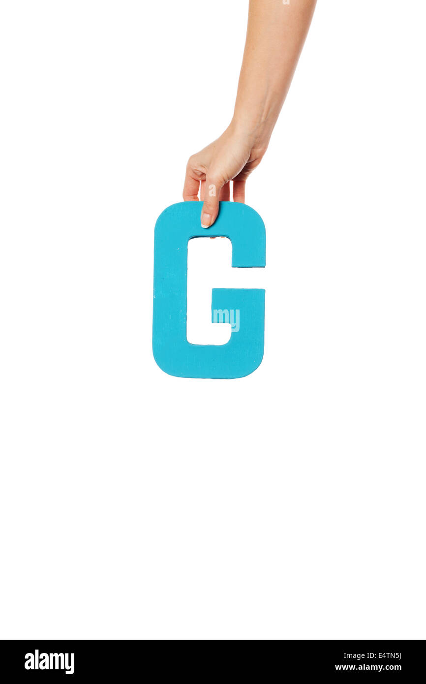 hand holding up the letter G from the top Stock Photo - Alamy