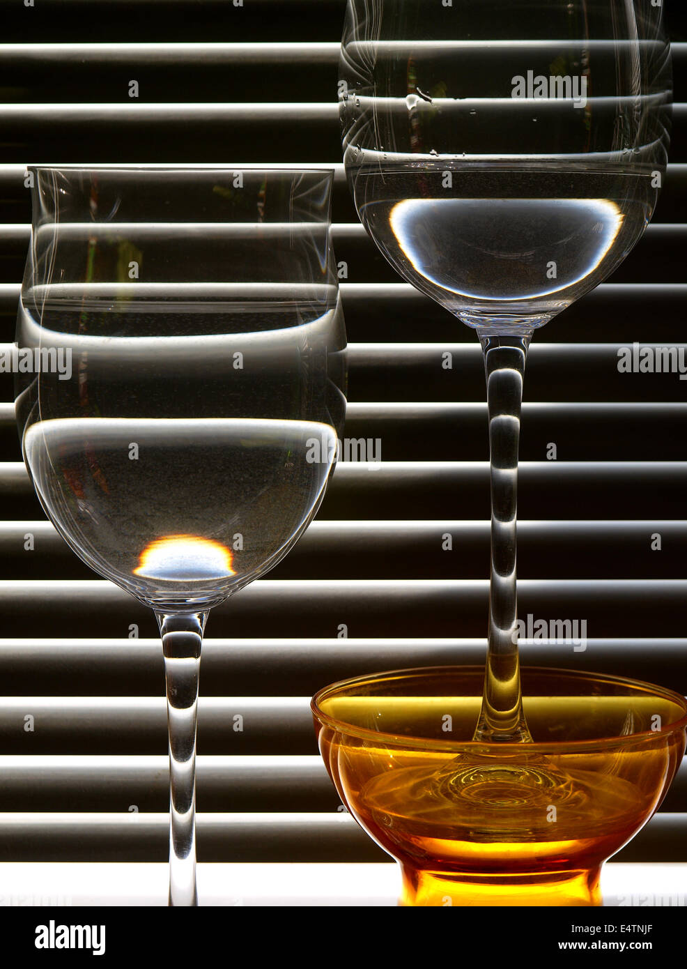 three glasses and blinds Stock Photo - Alamy