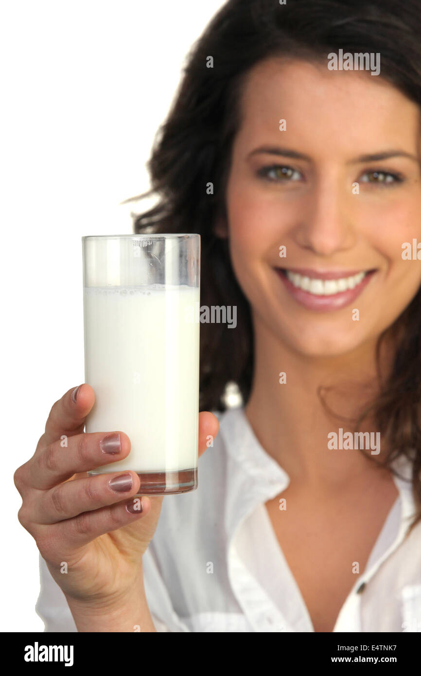 Woman drinking milk Stock Photo - Alamy