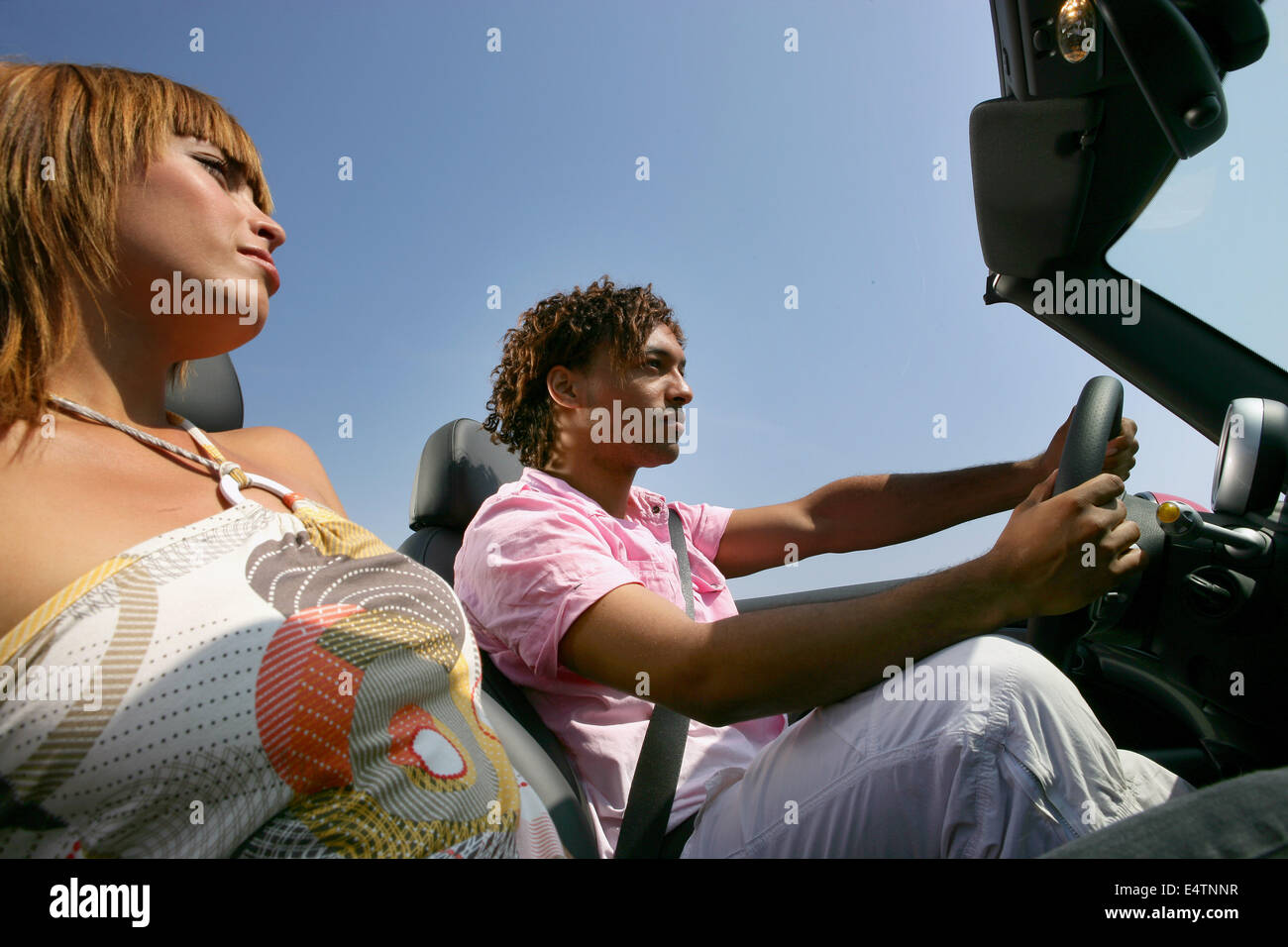 Couple in convertible car Stock Photo - Alamy