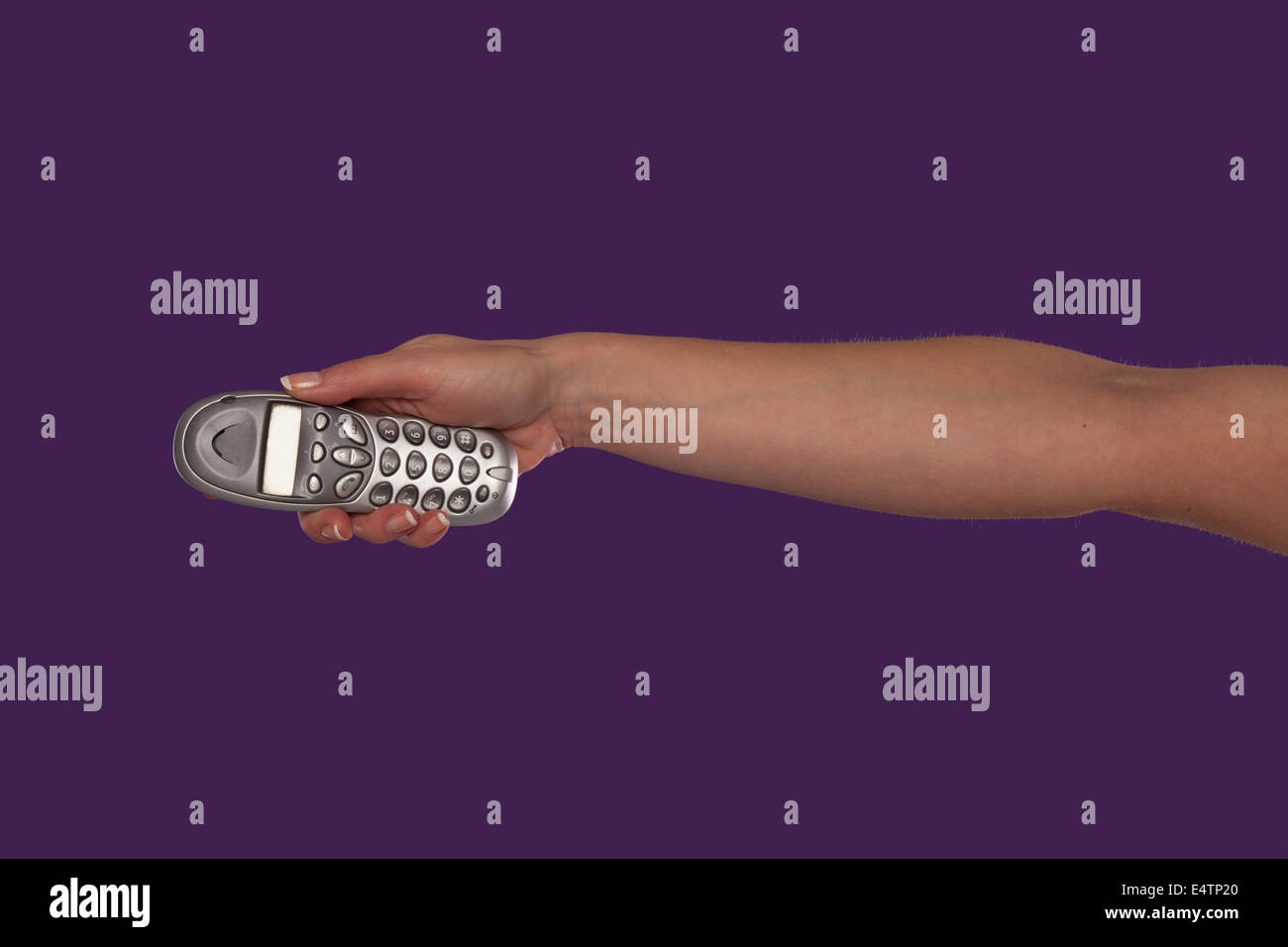 Female hand pointing a remote control Stock Photo - Alamy