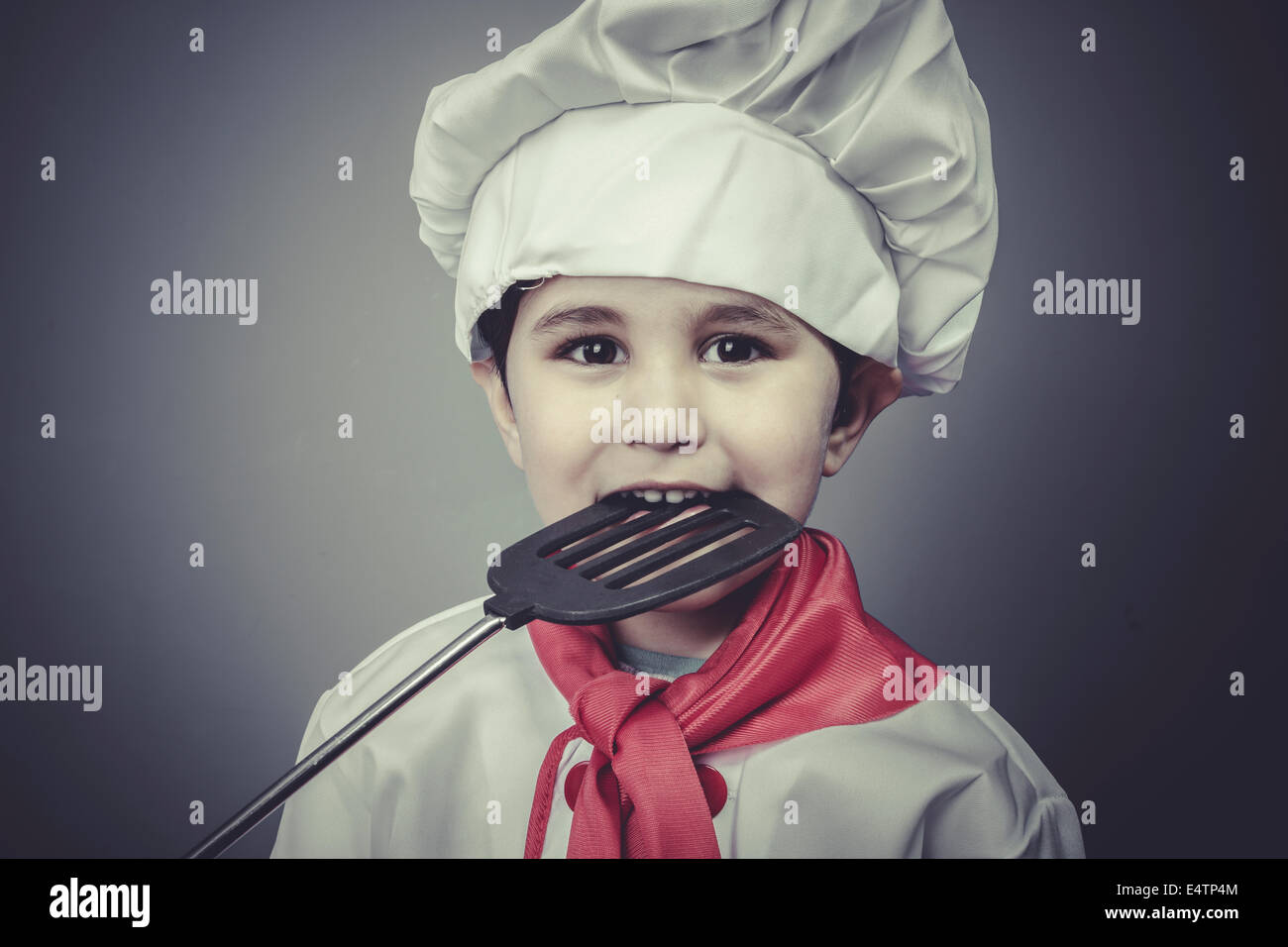 kid, boy dressed as a cook with kitchen utensils Stock Photo - Alamy