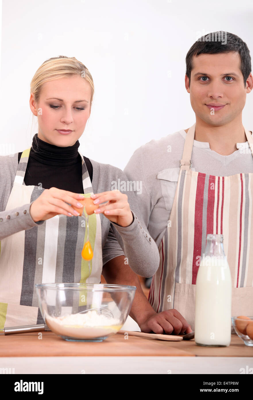Couple baking together Stock Photo - Alamy