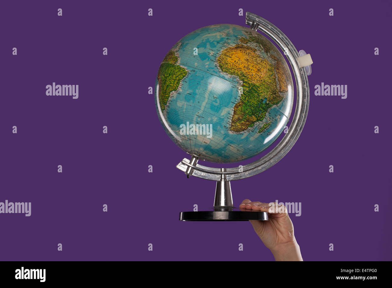 Female hand with a globe Stock Photo - Alamy