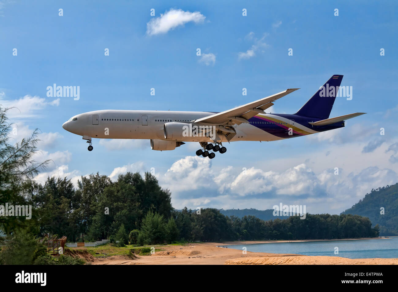 Aircraft is flying low over the beach hi-res stock photography and ...
