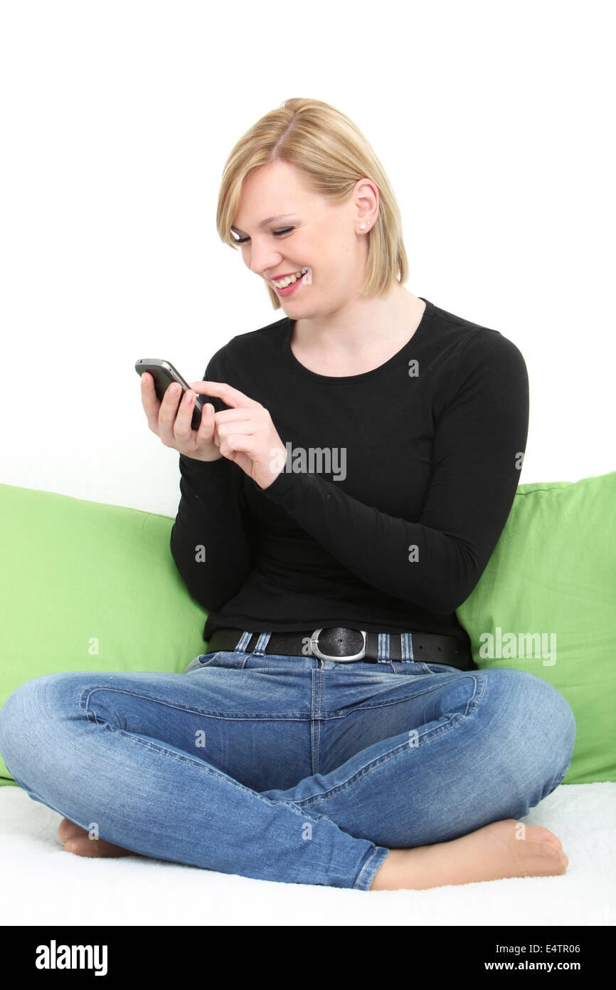 Smiling while texting Cut Out Stock Images & Pictures - Alamy