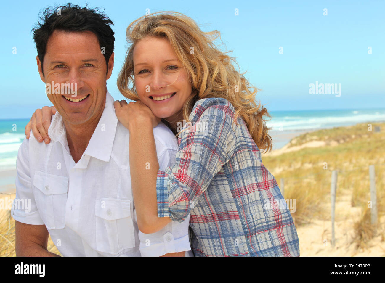 Couple by the sea Stock Photo - Alamy