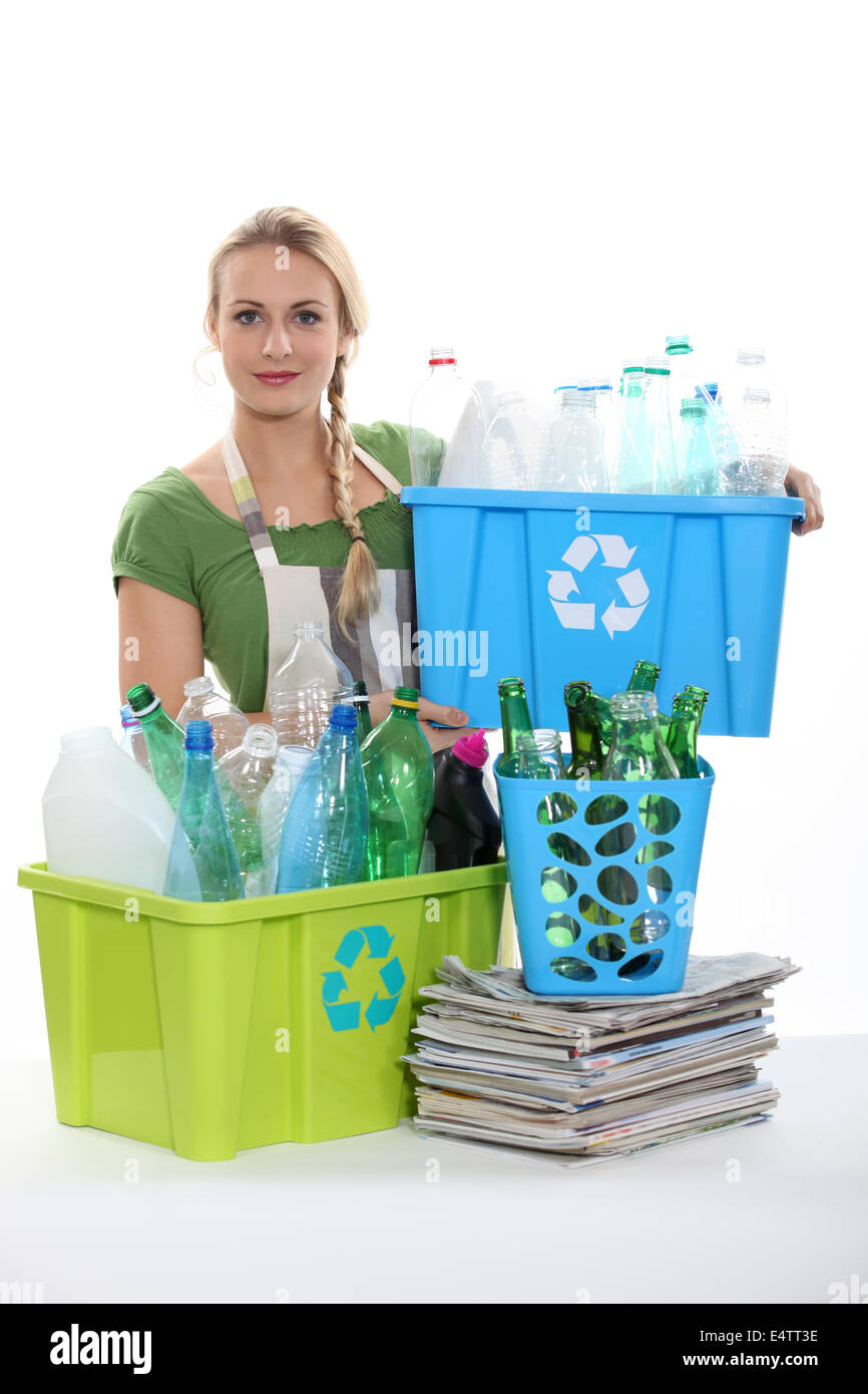 Blond woman recycling Stock Photo - Alamy