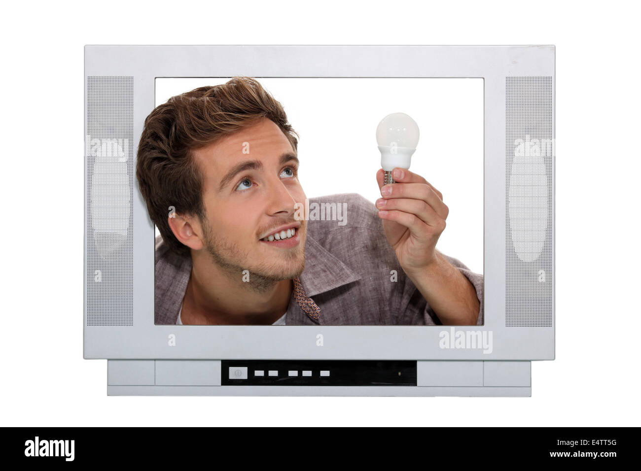 Man fitting light bulb inside television Stock Photo - Alamy