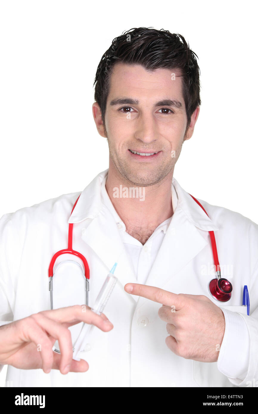 Doctor holding a needle Stock Photo - Alamy
