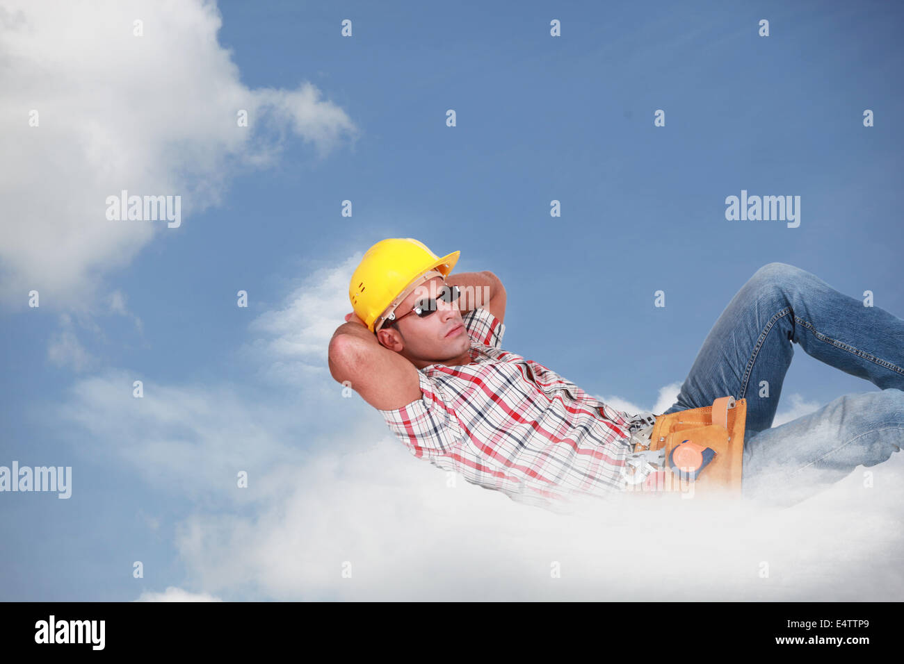 Relaxed worker laid on a cloud Stock Photo - Alamy
