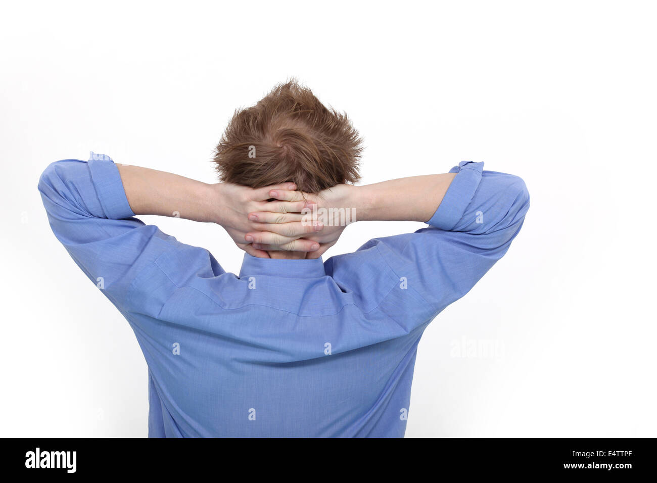 Man with his hands clasped behind his neck Stock Photo - Alamy