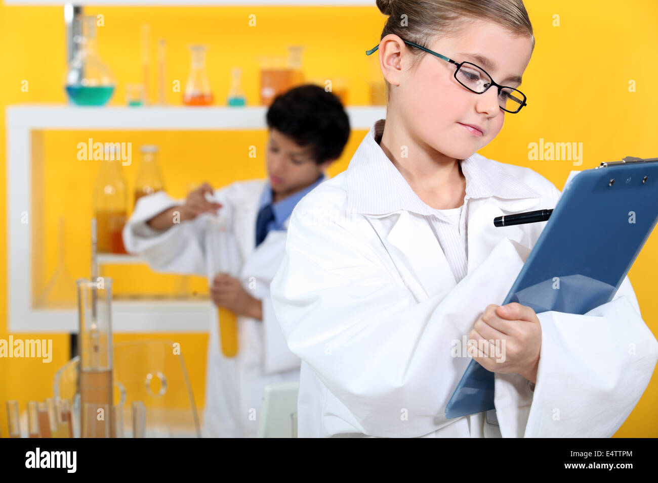 two children working in a lab Stock Photo - Alamy