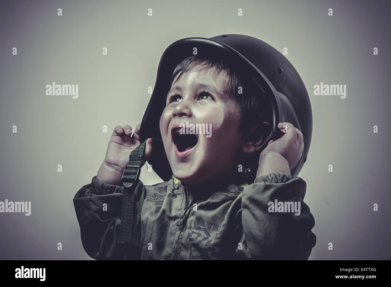 uniform, fun and funny child dressed in military cap, playing war games ...