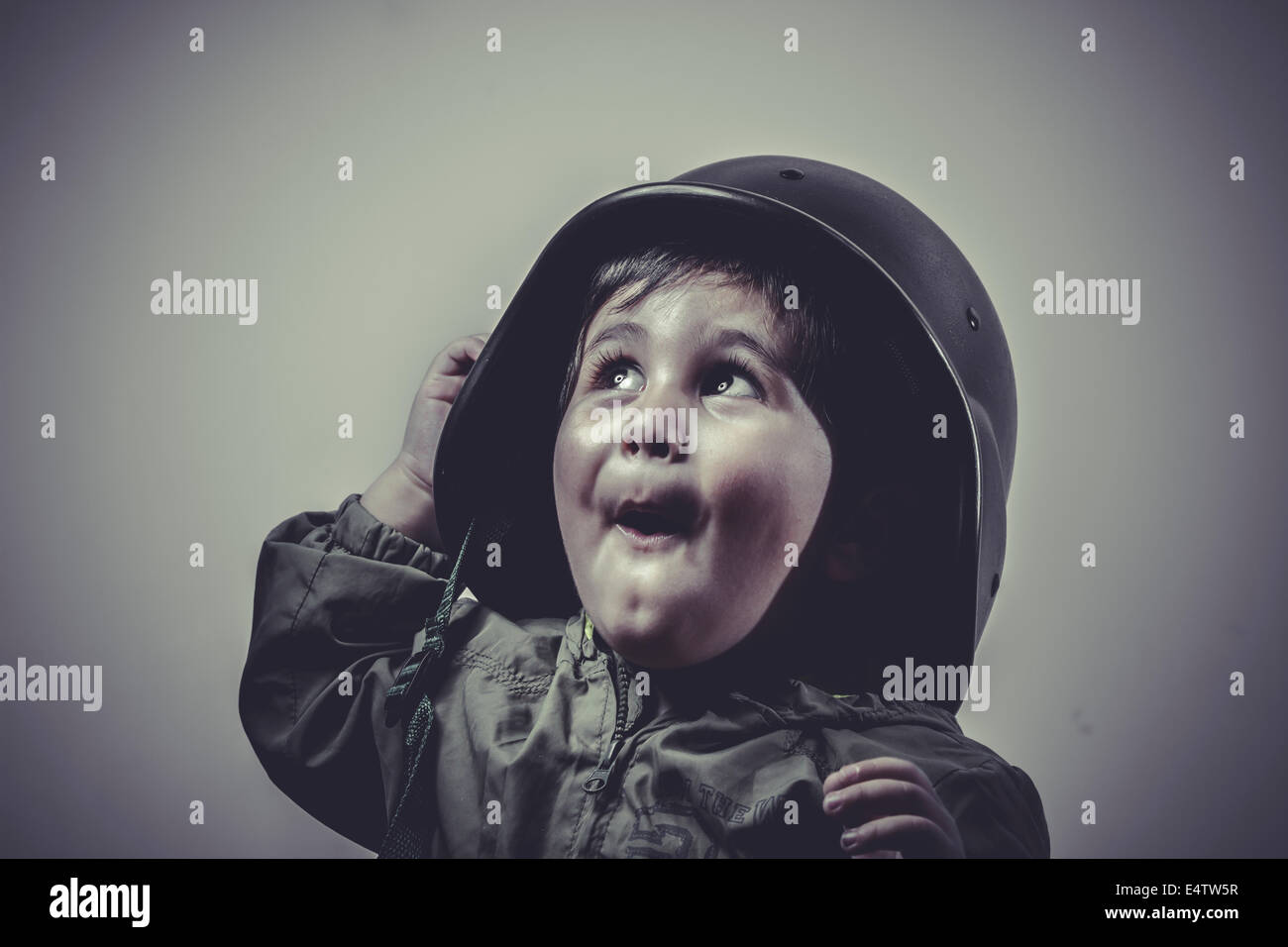 soldier fun and funny child dressed in military cap, playing war games ...