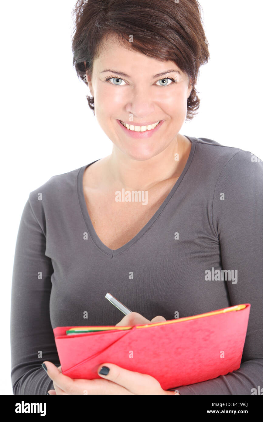 Happy woman taking notes Stock Photo - Alamy