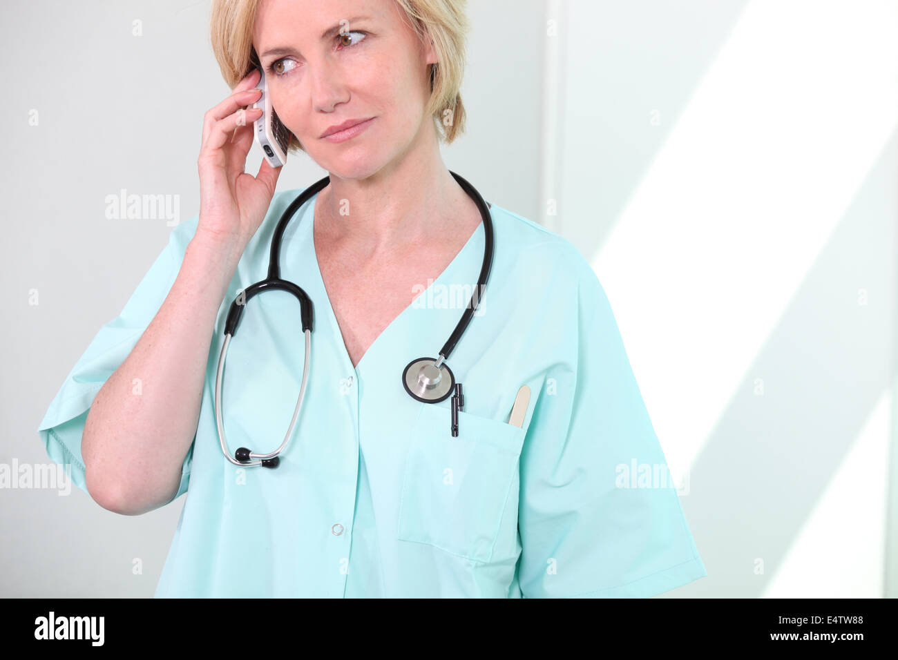 Nurse on the phone Stock Photo - Alamy