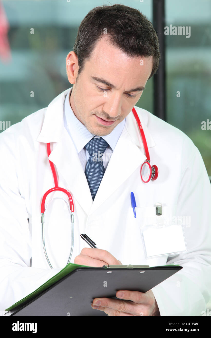 a doctor writing a prescription Stock Photo - Alamy