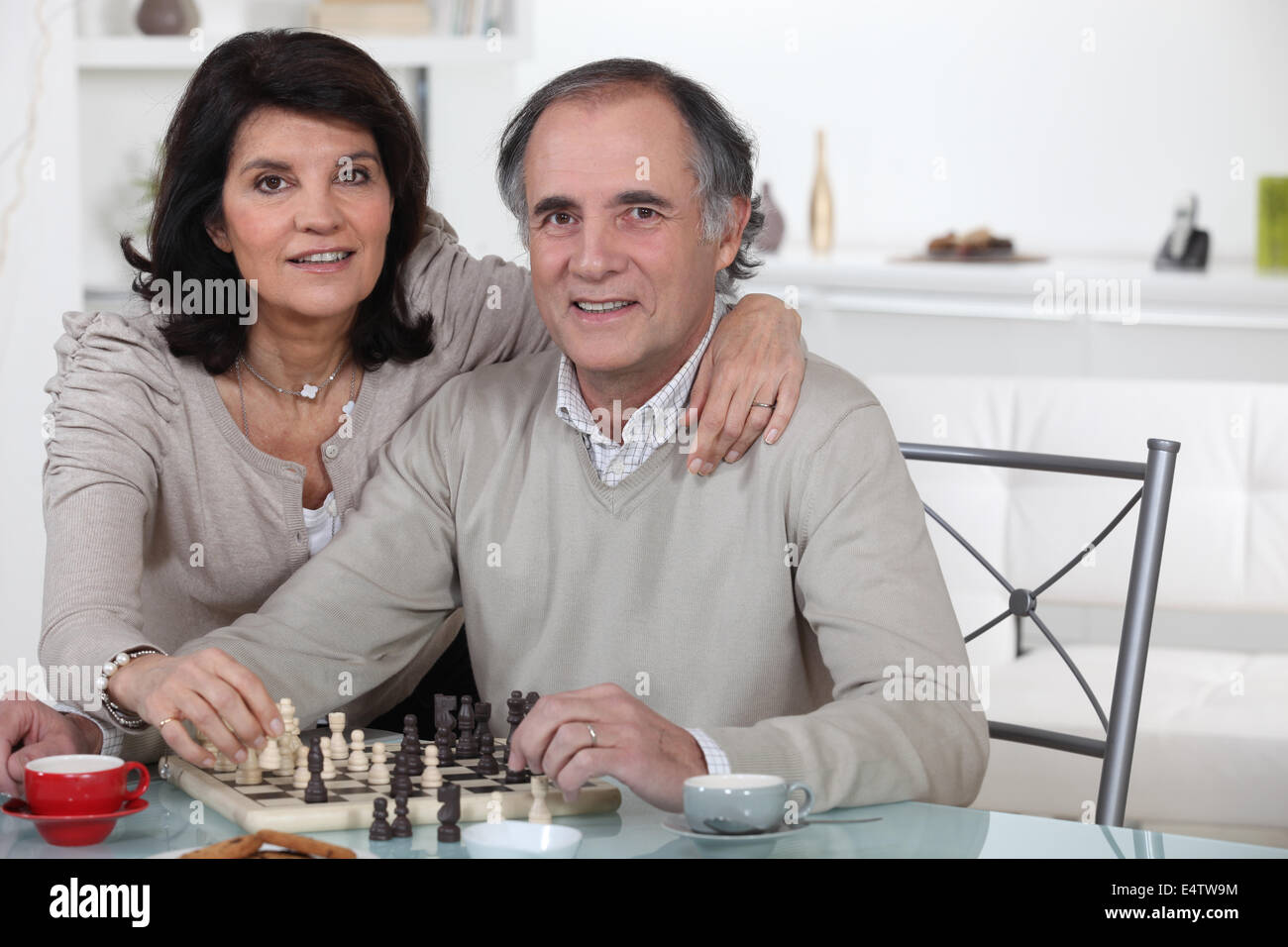 Married couple playing chess together Stock Photo - Alamy