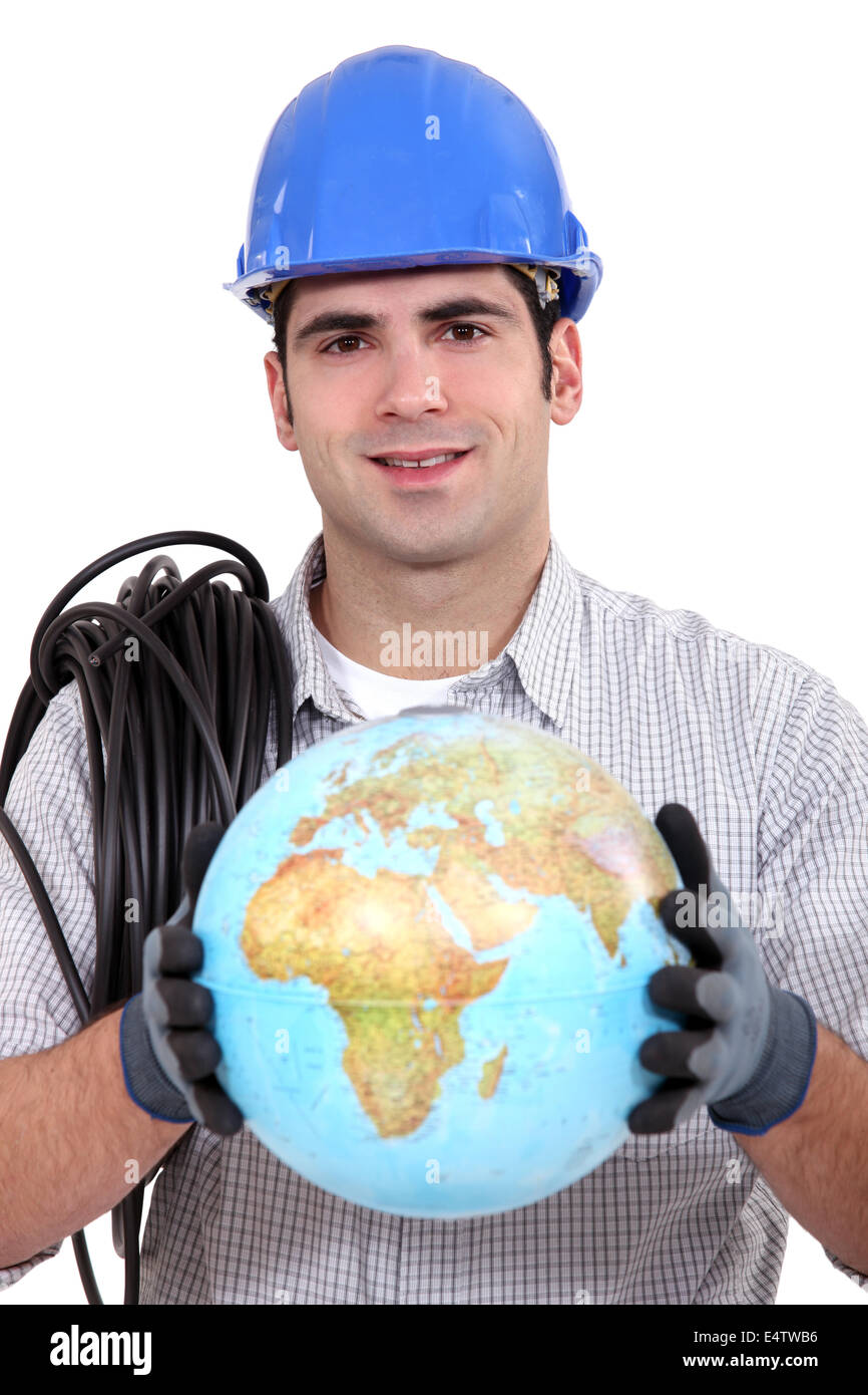 Electrician holding a globe Stock Photo - Alamy