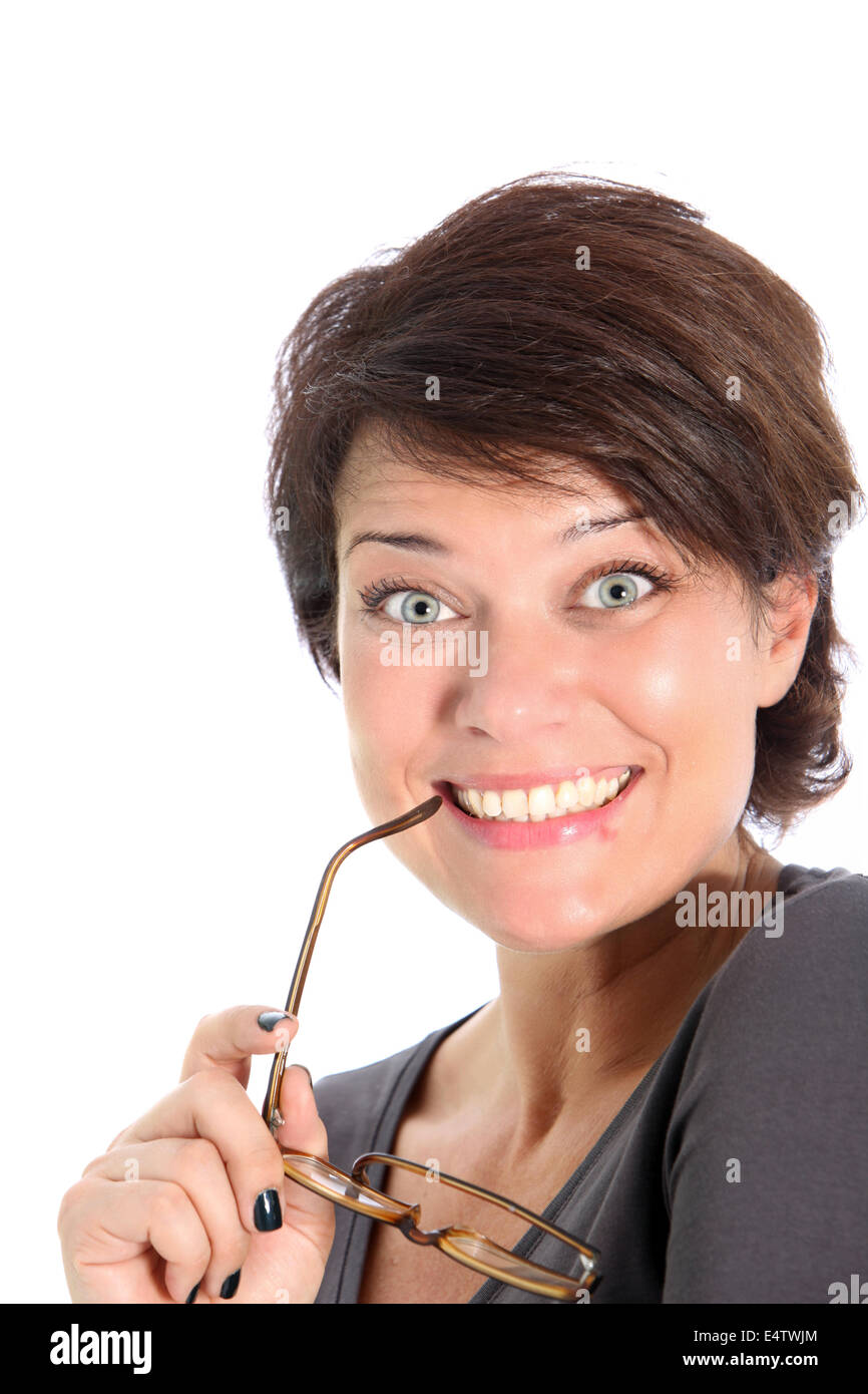 Excited woman holding her glasses Stock Photo - Alamy