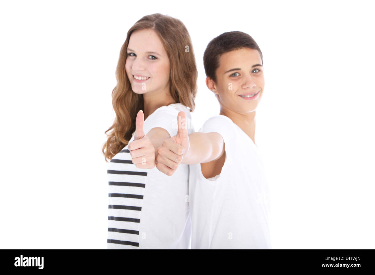 Happy brother and sister giving a thumbs up Stock Photo - Alamy