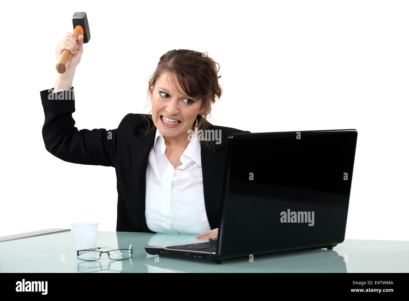 Woman threatening computer with hammer Stock Photo - Alamy Woman threatening computer with hammer Stock Photo - Alamy