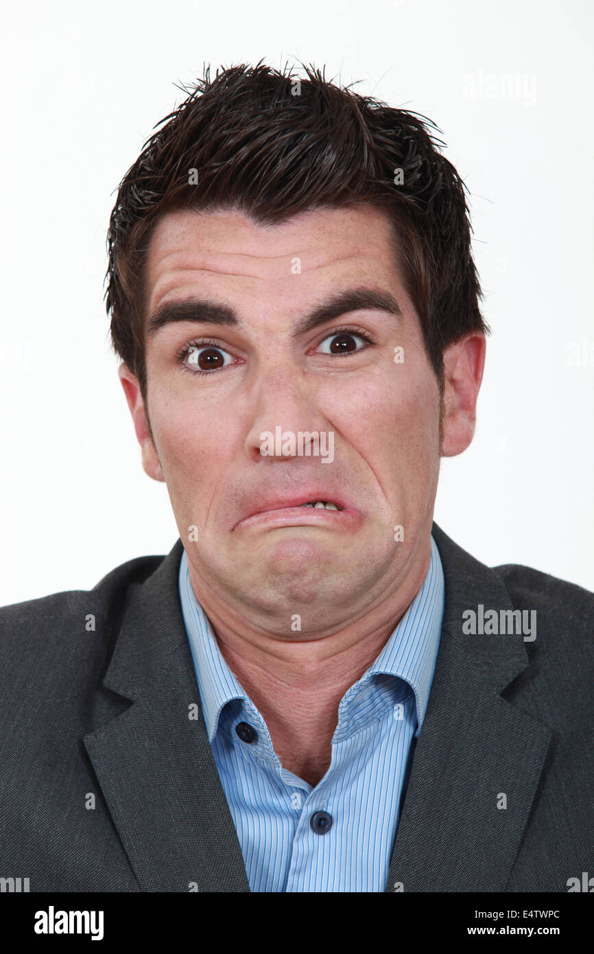 Portrait of a man grimacing Stock Photo - Alamy