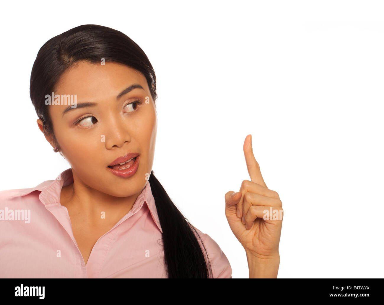 Asian woman pointing upwards Stock Photo - Alamy