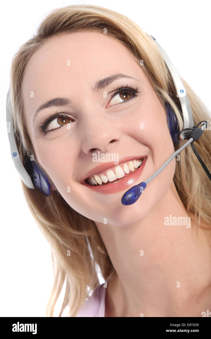 Smiling receptionist wearing a headset Stock Photo - Alamy