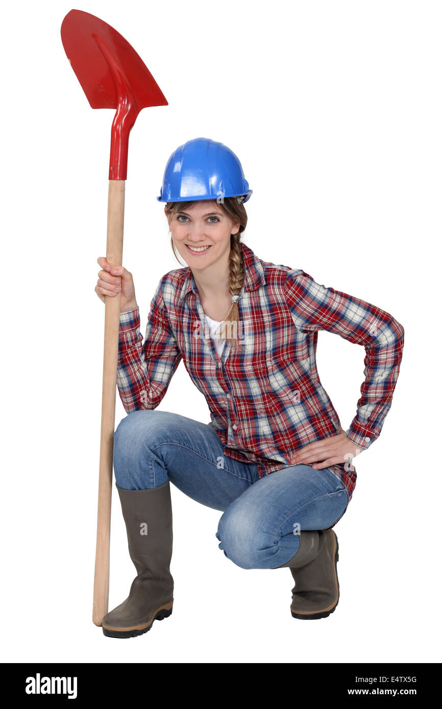 Woman holding spade Stock Photo - Alamy