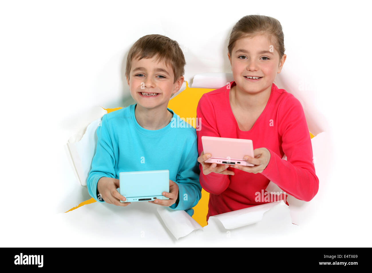 Kids with portable games console Stock Photo - Alamy