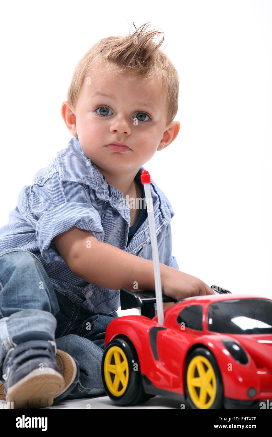 little boy playing with toy car Stock Photo - Alamy