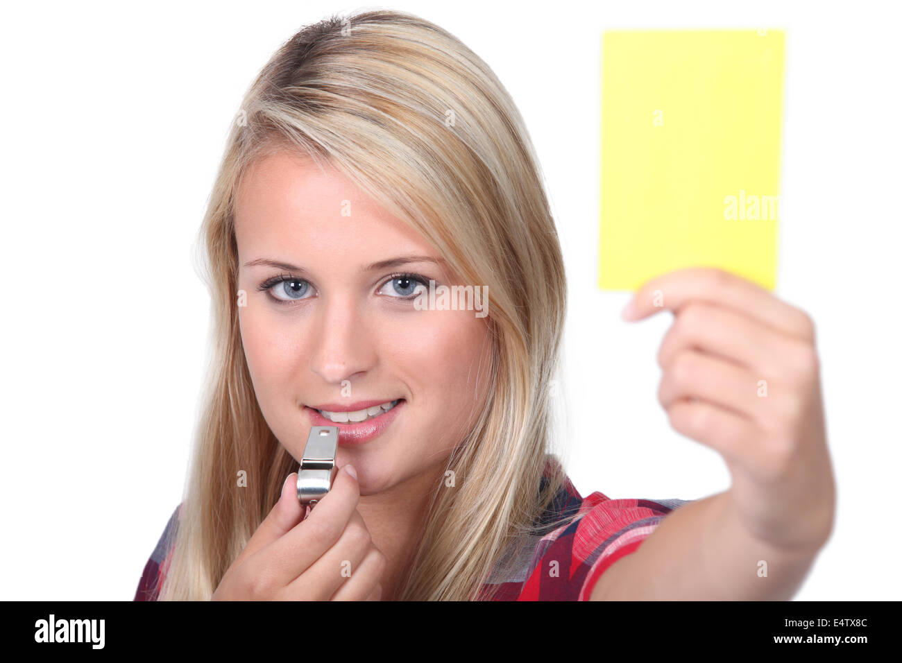 Girl showing the yellow card Stock Photo - Alamy