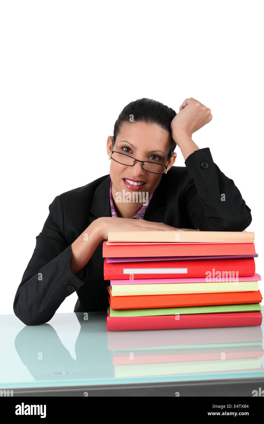 Brunette surrounded by paperwork Stock Photo - Alamy
