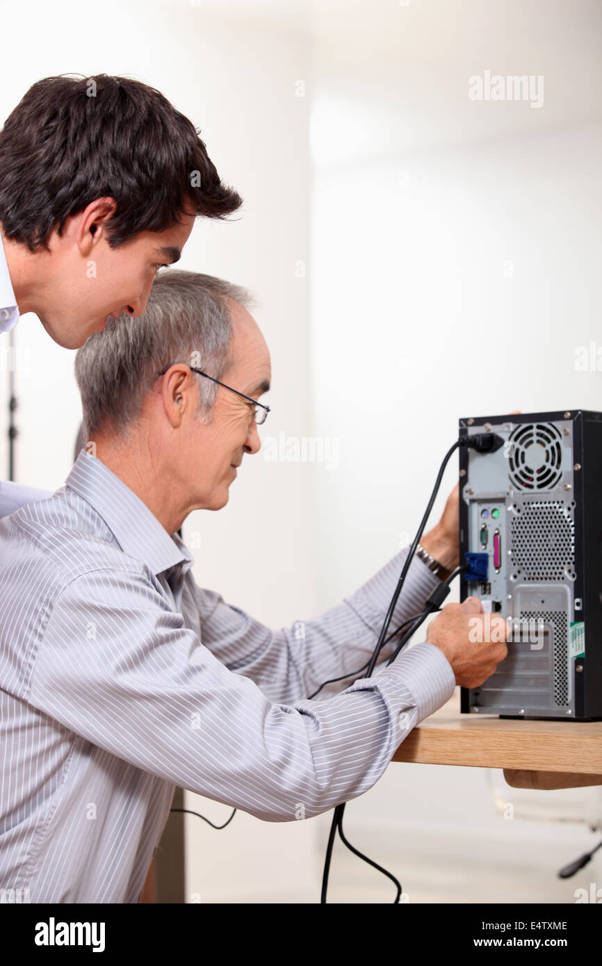 Father and son repairing PC Stock Photo - Alamy
