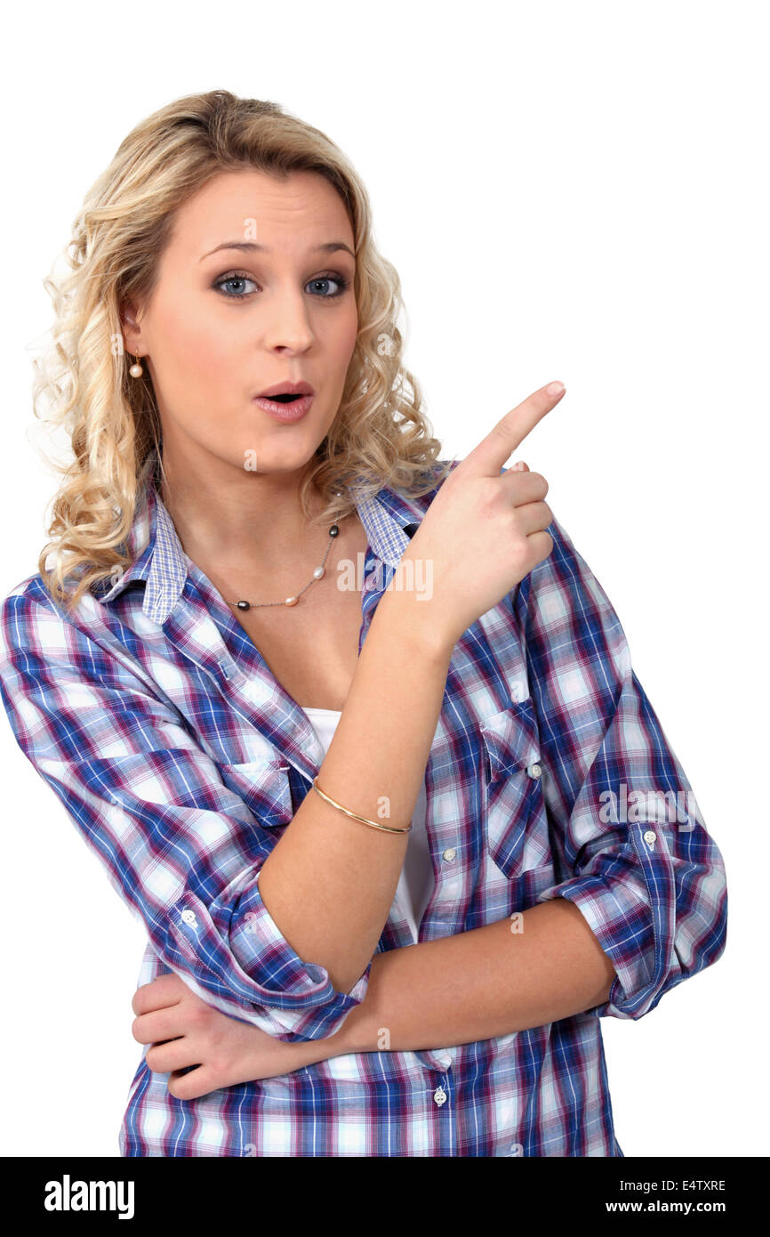 young blonde woman showing something Stock Photo - Alamy